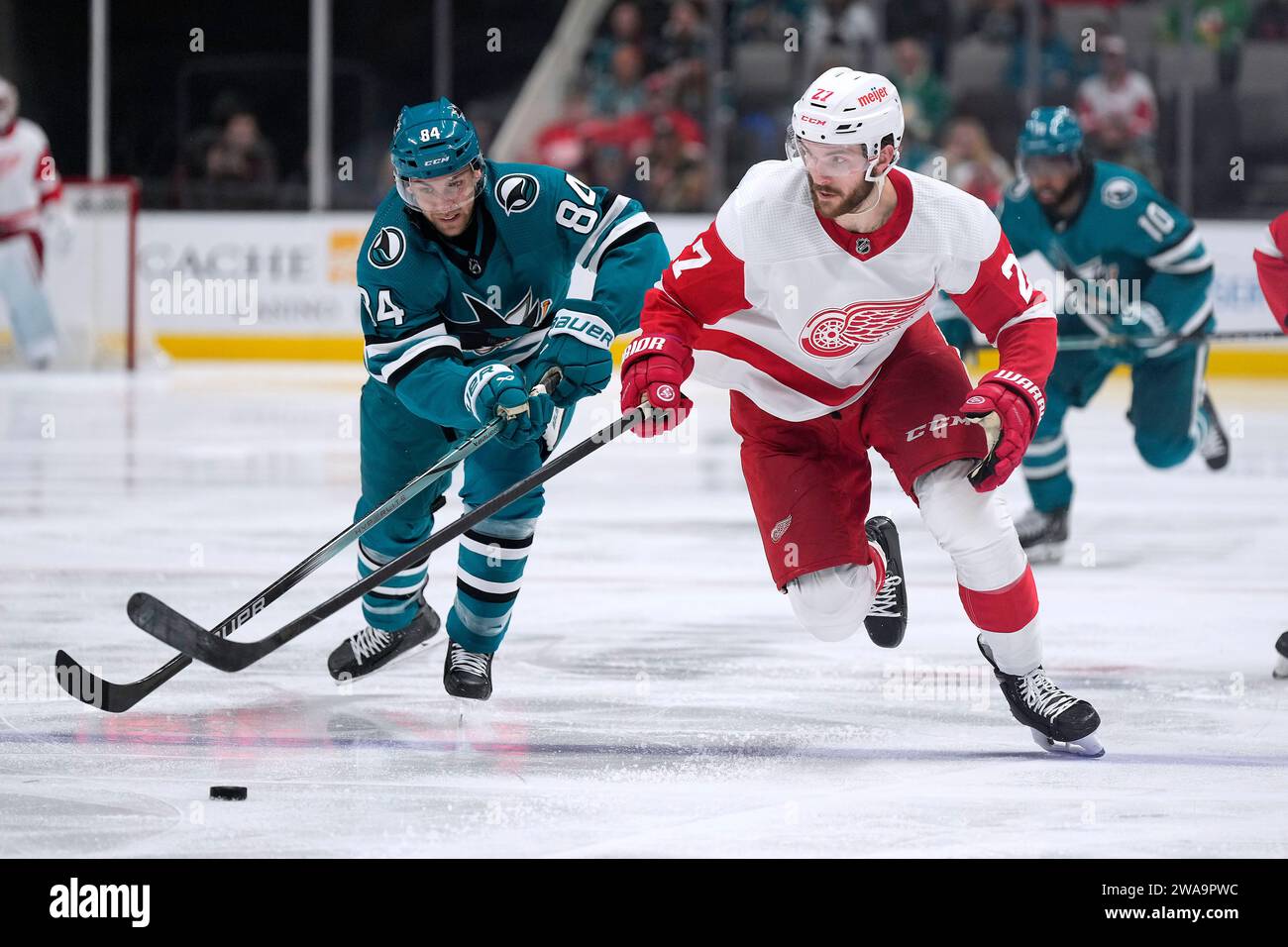 Detroit Red Wings center Michael Rasmussen (27) moves the puck up the ...