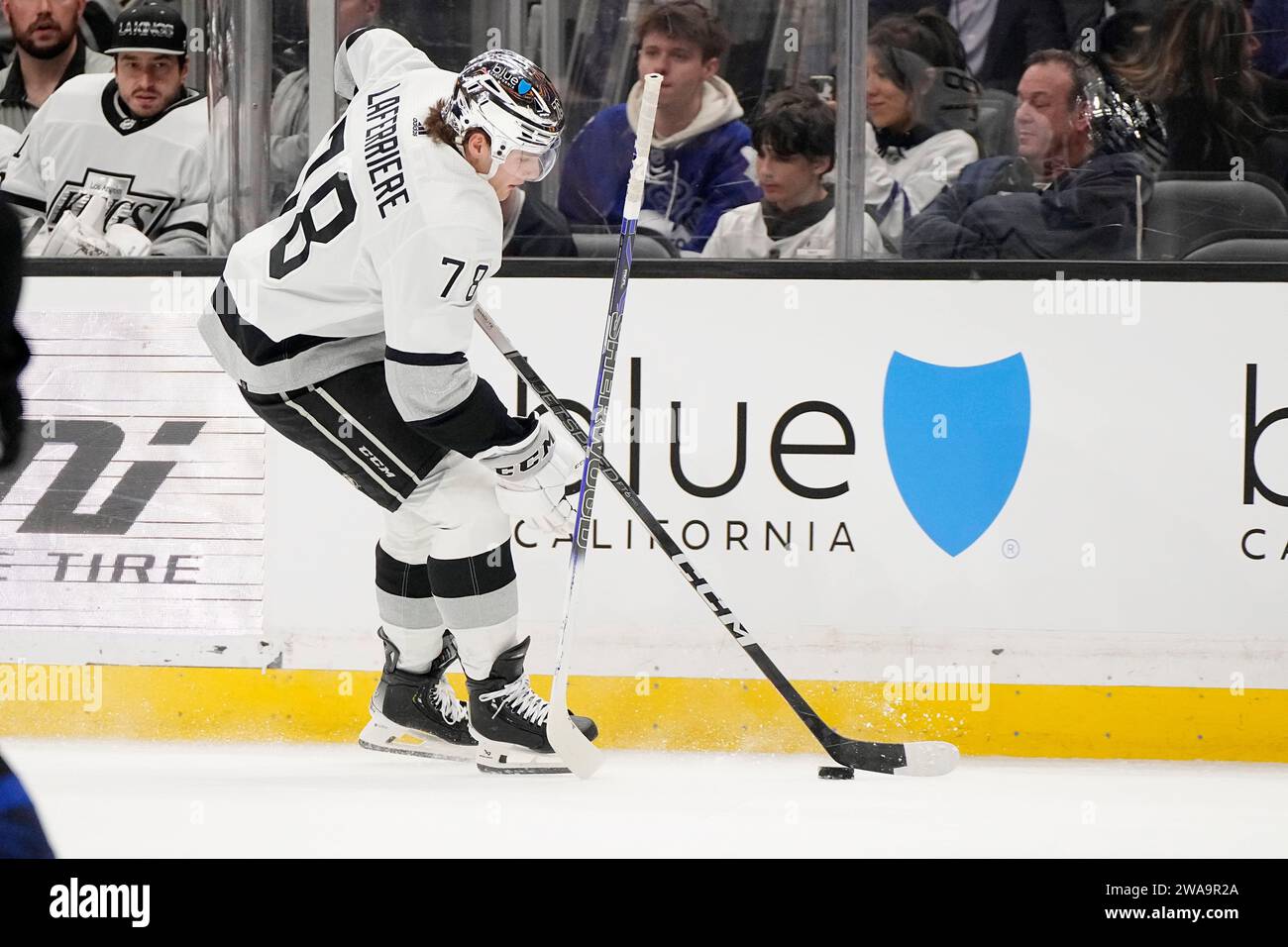 Los Angeles Kings right wing Alex Laferriere moves the puck as he drags ...
