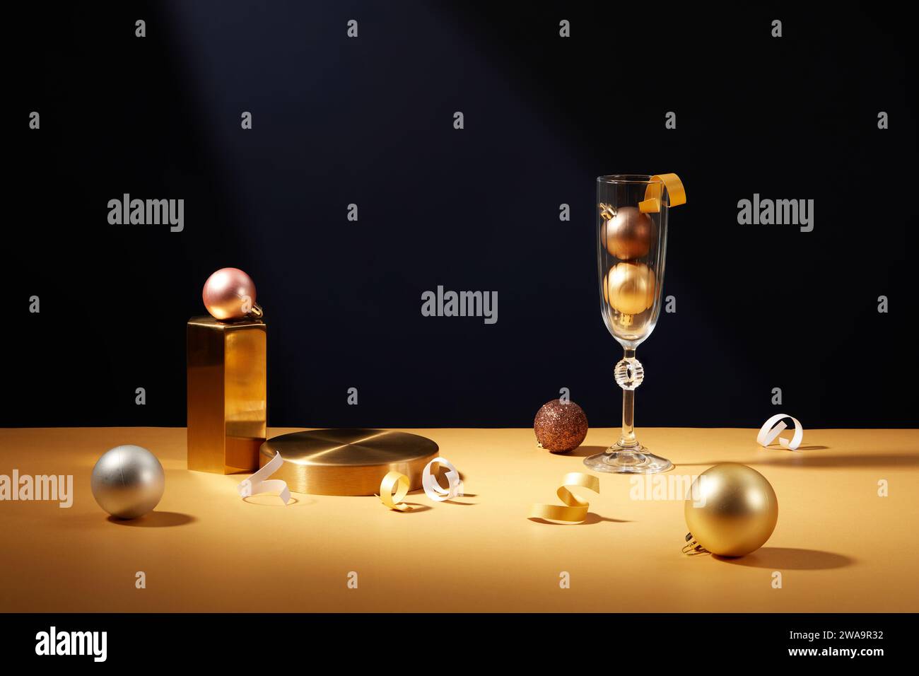 Golden platforms in rectangle and round shaped arranged with a glass of ...