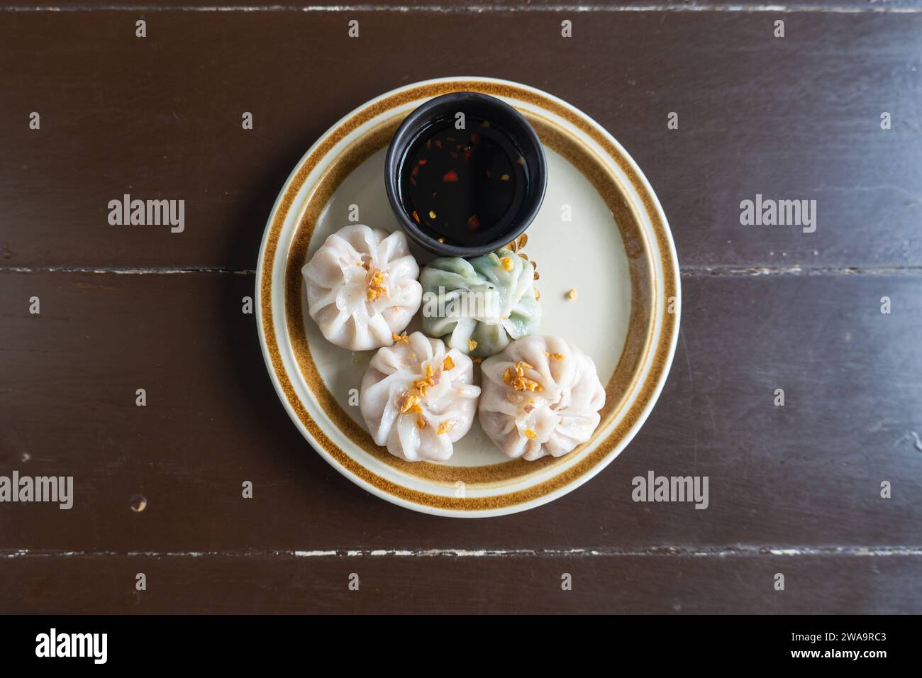 Image of plates containing steamed and chives dumplings, white flour ...