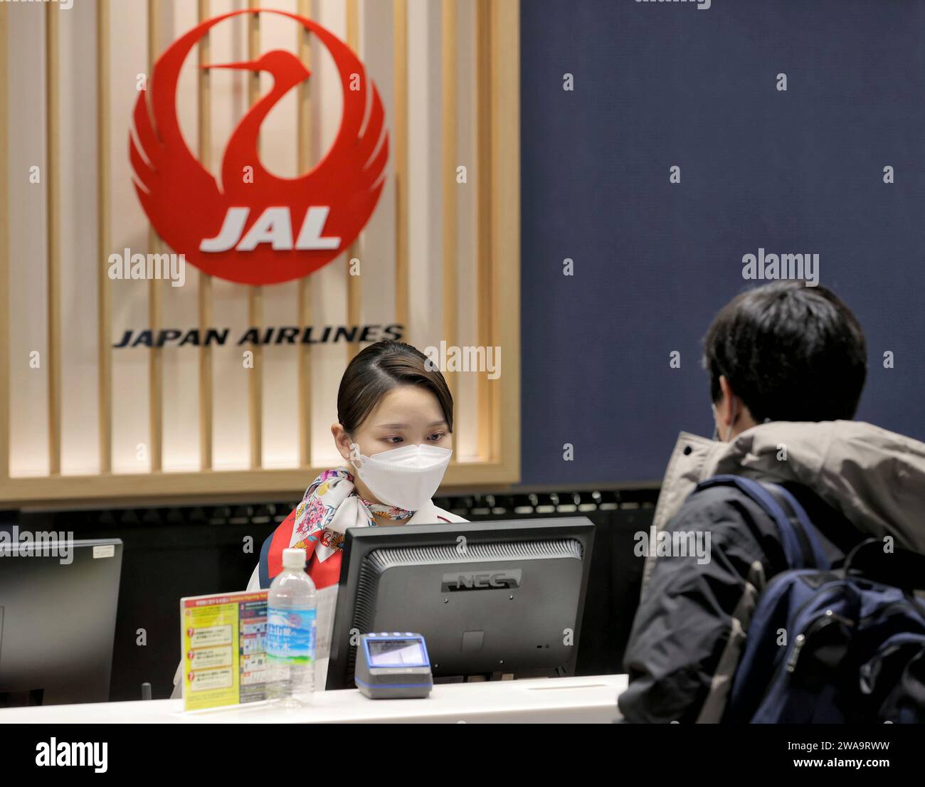 Passengers check in Japan Airlines counter at Shin-Chitose Airport in Hokkaido on Jan.3rd, 2024 ...