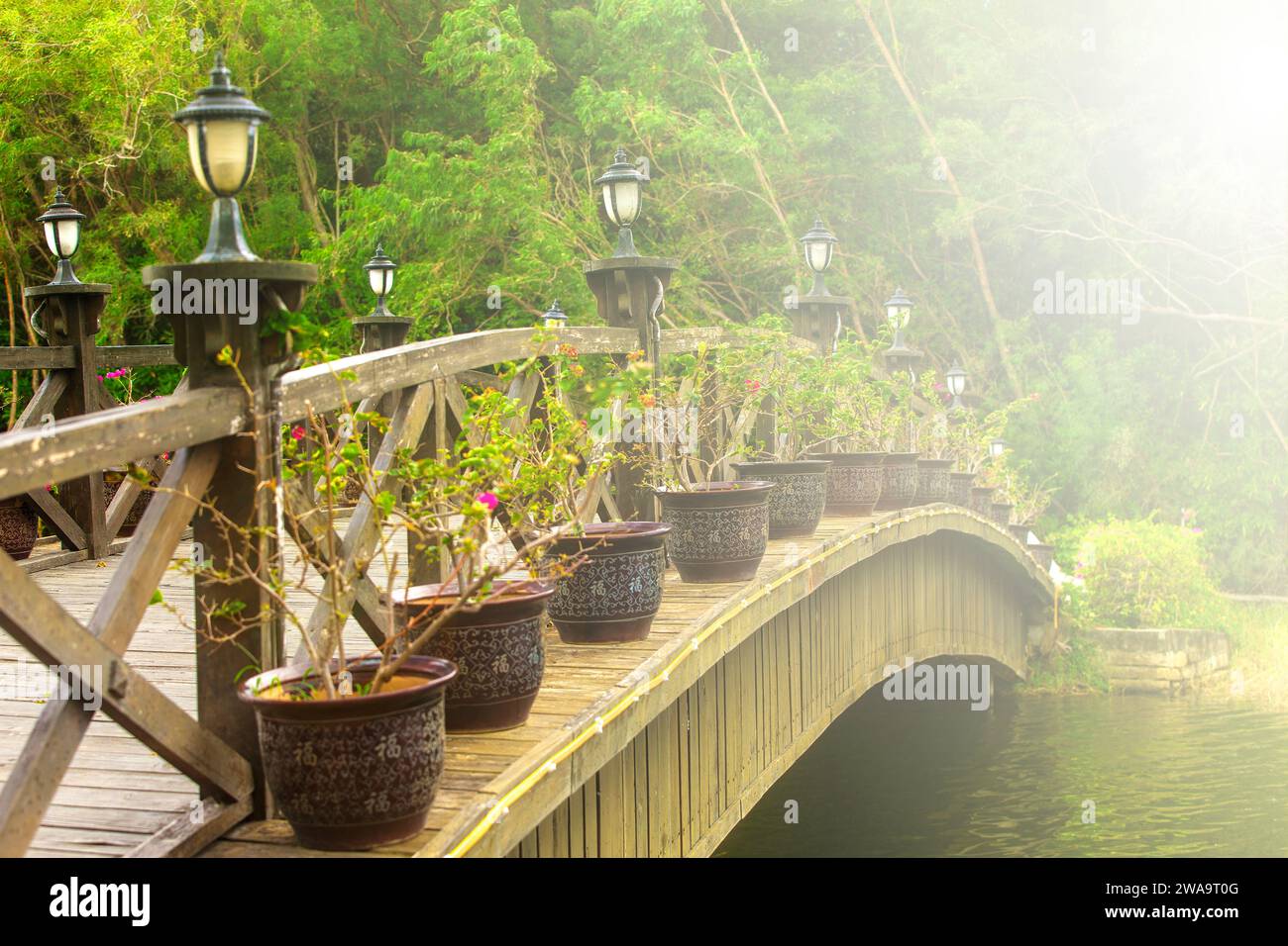 The Beautiful wooden bridge across river on soft sunlight Stock Photo ...