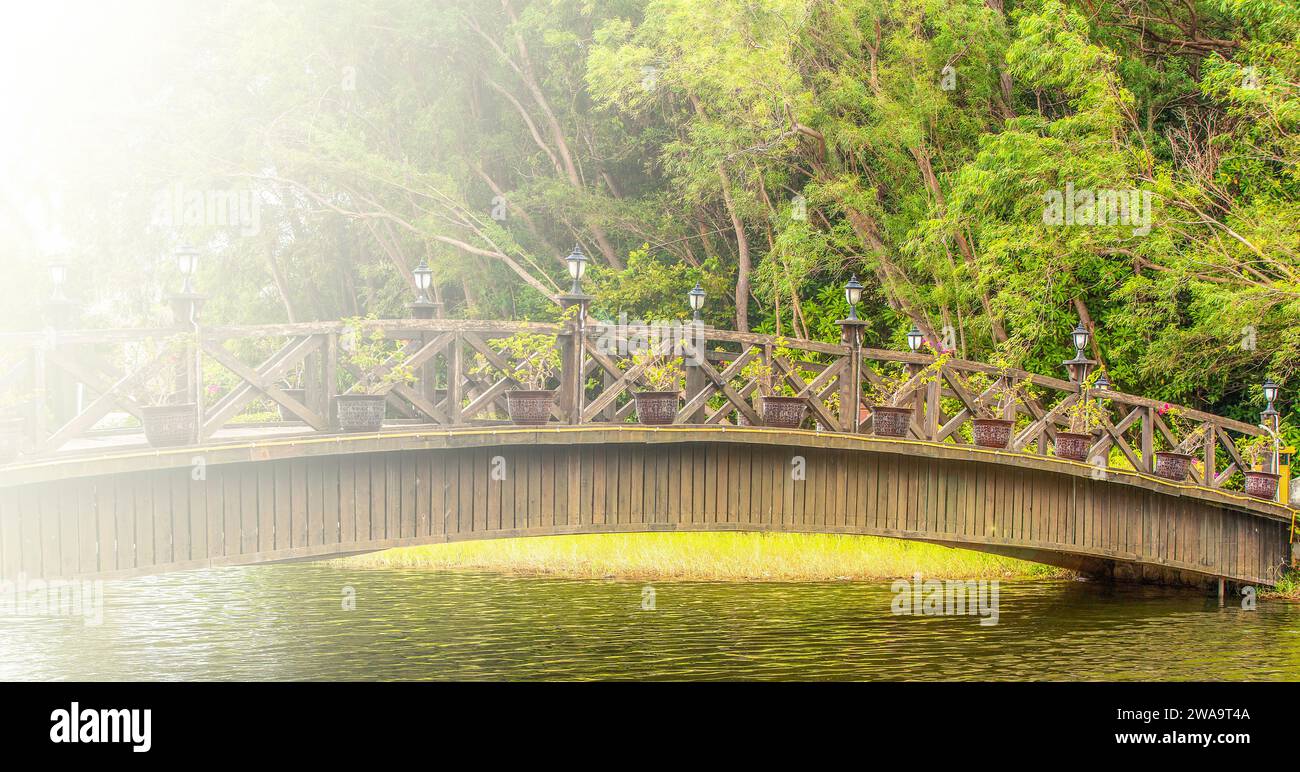 The Beautiful wooden bridge across river on soft sunlight Stock Photo ...