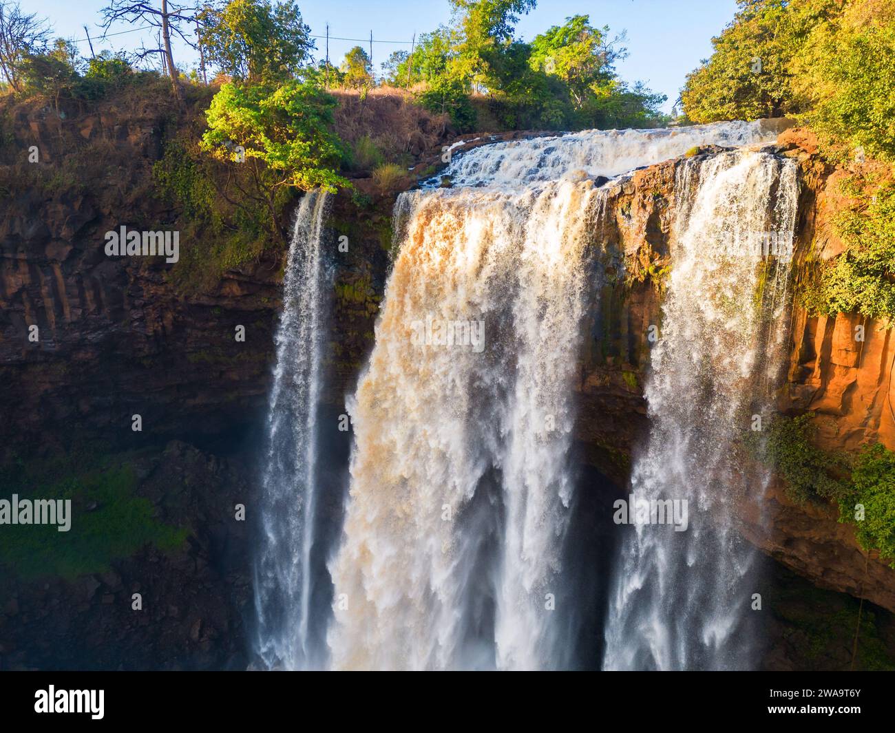 Vast majestic waterfall surrounded rainforest, drone view Stock Photo ...