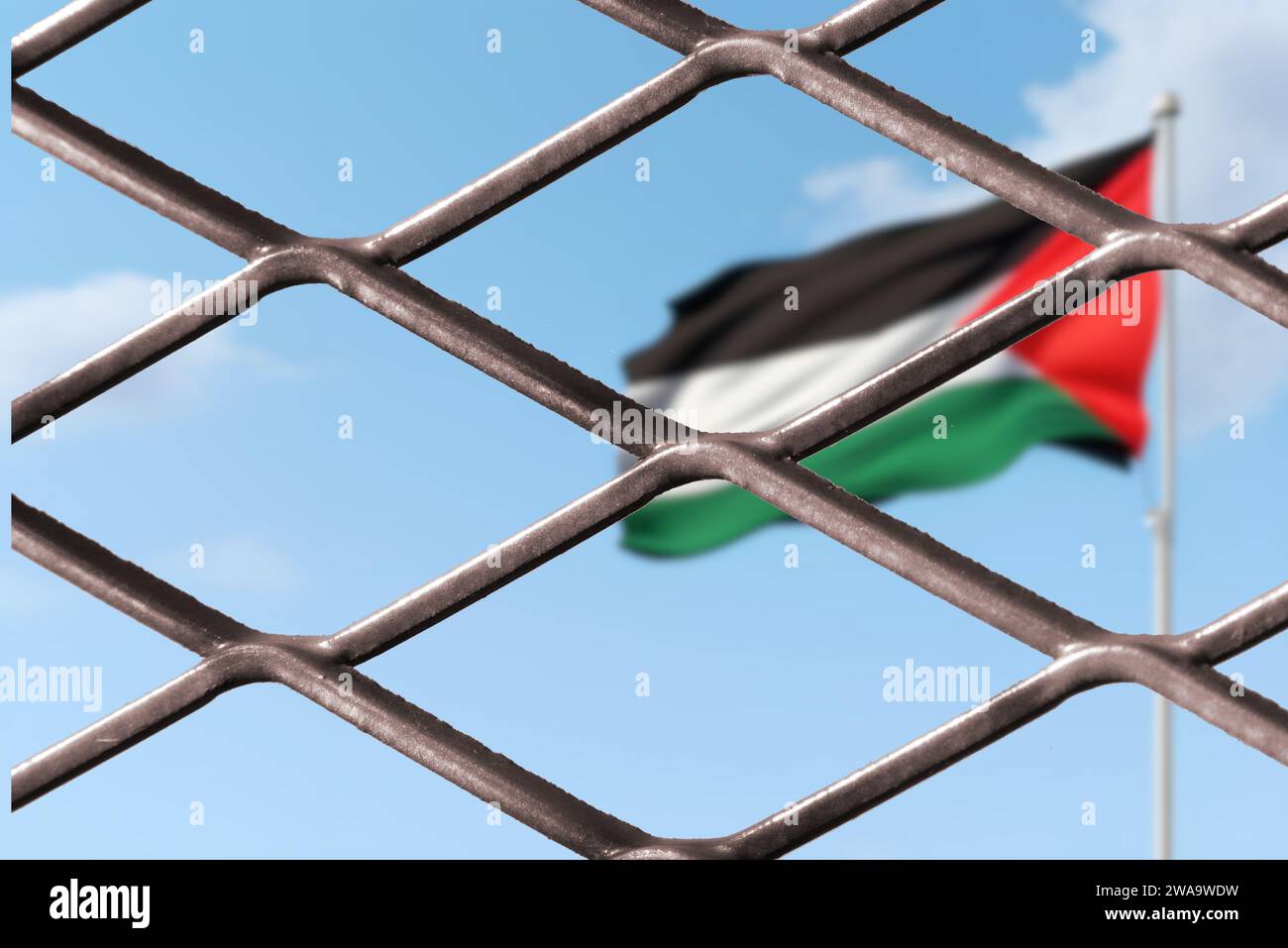 Flag of Palestine behind a fence Stock Photo - Alamy