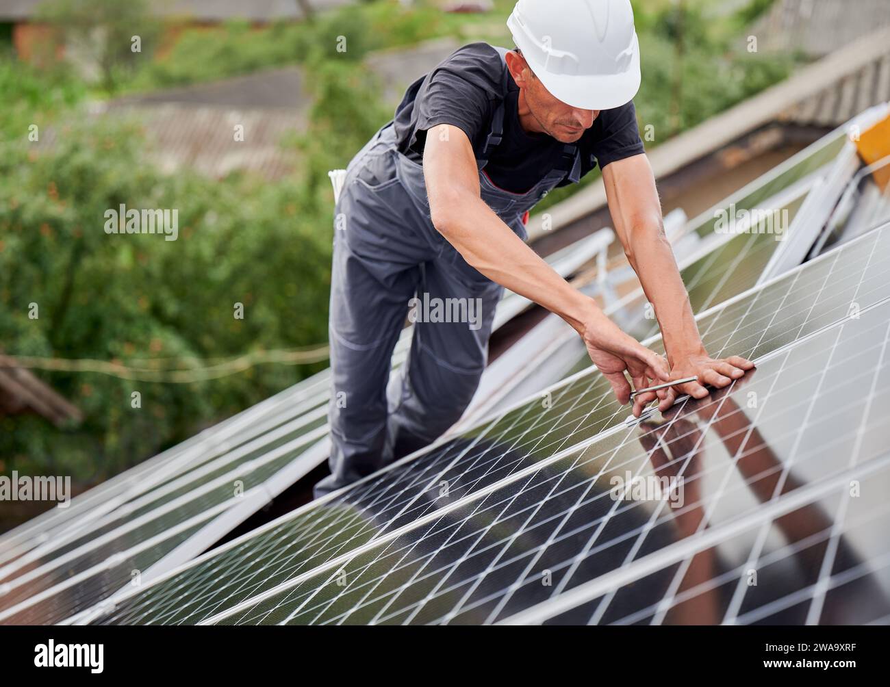 Worker tightening solar panel hi-res stock photography and images - Alamy
