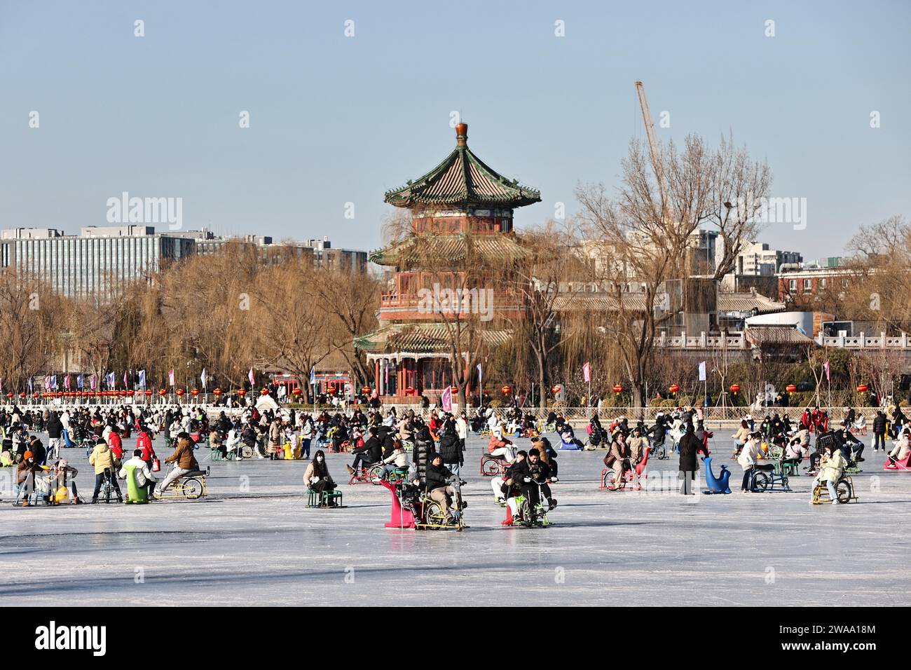 Tourists enjoy ice and snow fun at Shichahai ice rink in Beijing, China ...