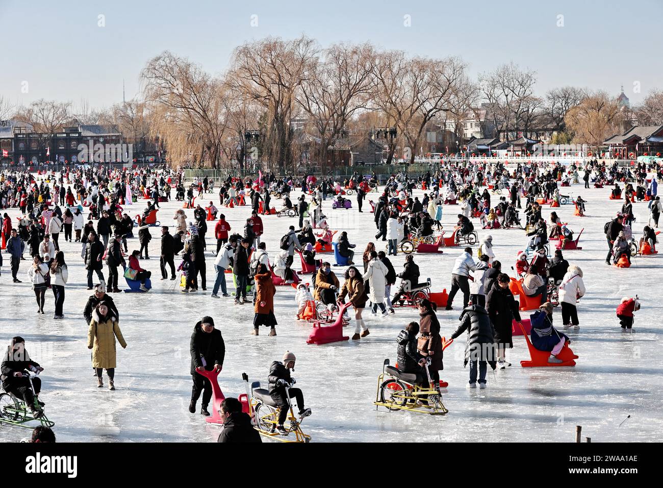 Tourists enjoy ice and snow fun at Shichahai ice rink in Beijing, China ...