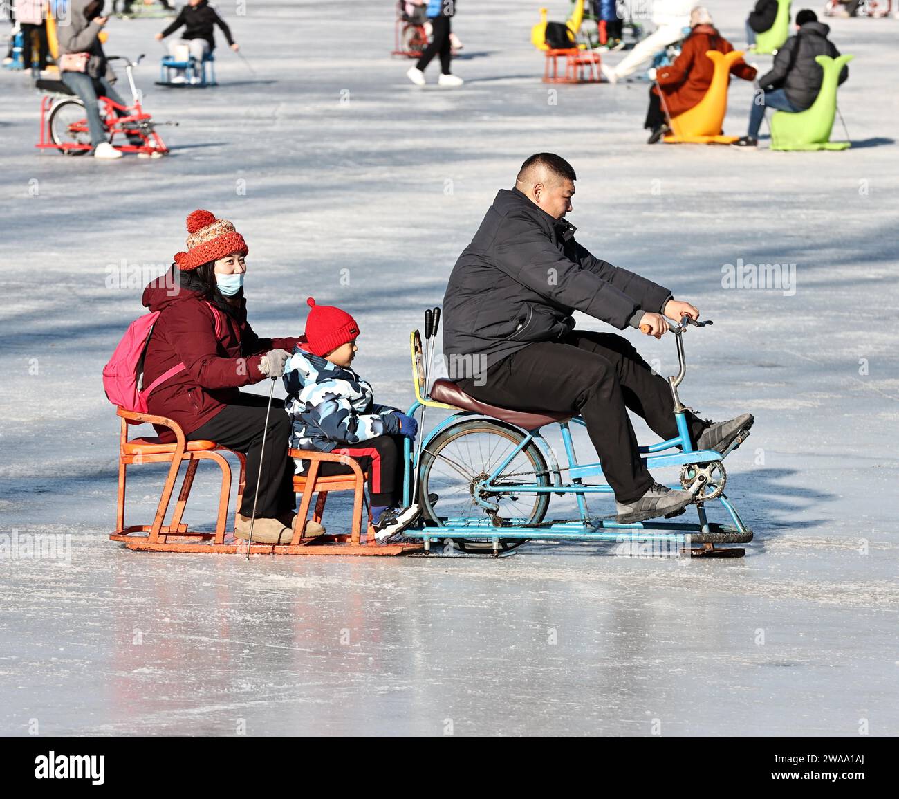 Tourists enjoy ice and snow fun at Shichahai ice rink in Beijing, China ...