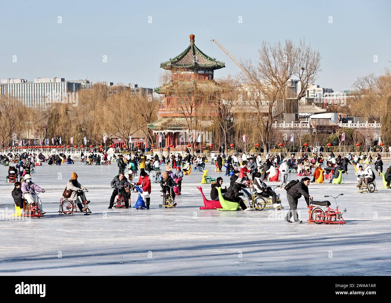 Tourists enjoy ice and snow fun at Shichahai ice rink in Beijing, China ...