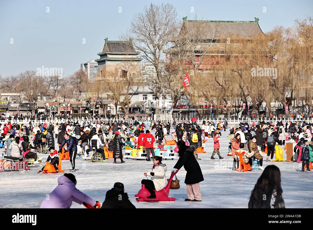 Tourists enjoy ice and snow fun at Shichahai ice rink in Beijing, China ...