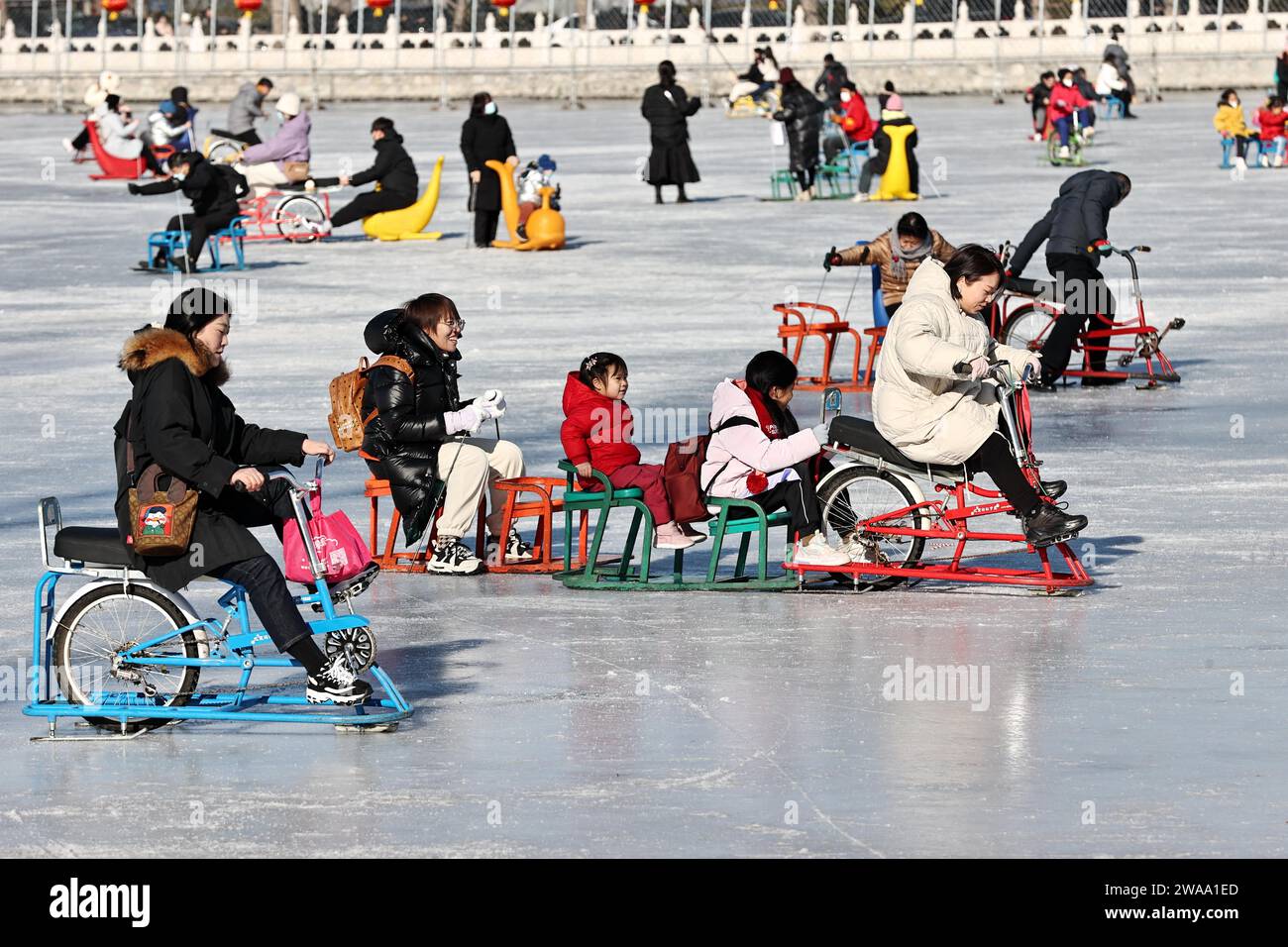 Tourists enjoy ice and snow fun at Shichahai ice rink in Beijing, China ...