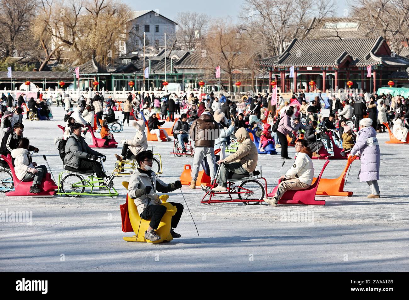 Tourists enjoy ice and snow fun at Shichahai ice rink in Beijing, China ...