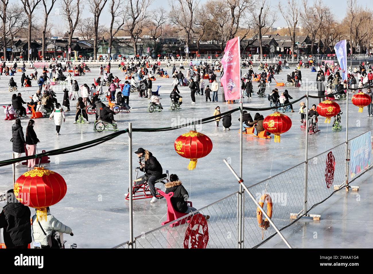 Tourists enjoy ice and snow fun at Shichahai ice rink in Beijing, China ...
