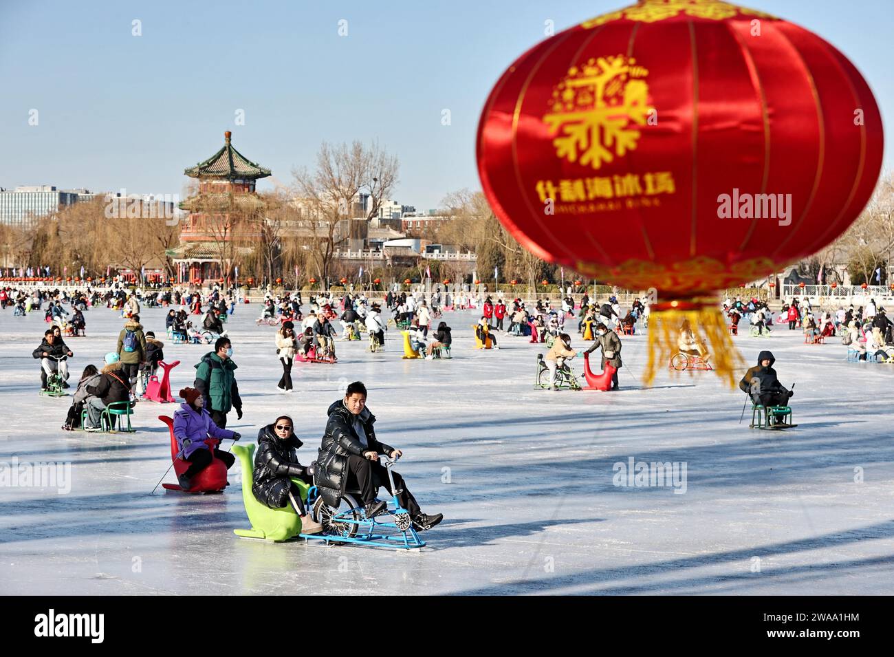 Tourists enjoy ice and snow fun at Shichahai ice rink in Beijing, China ...