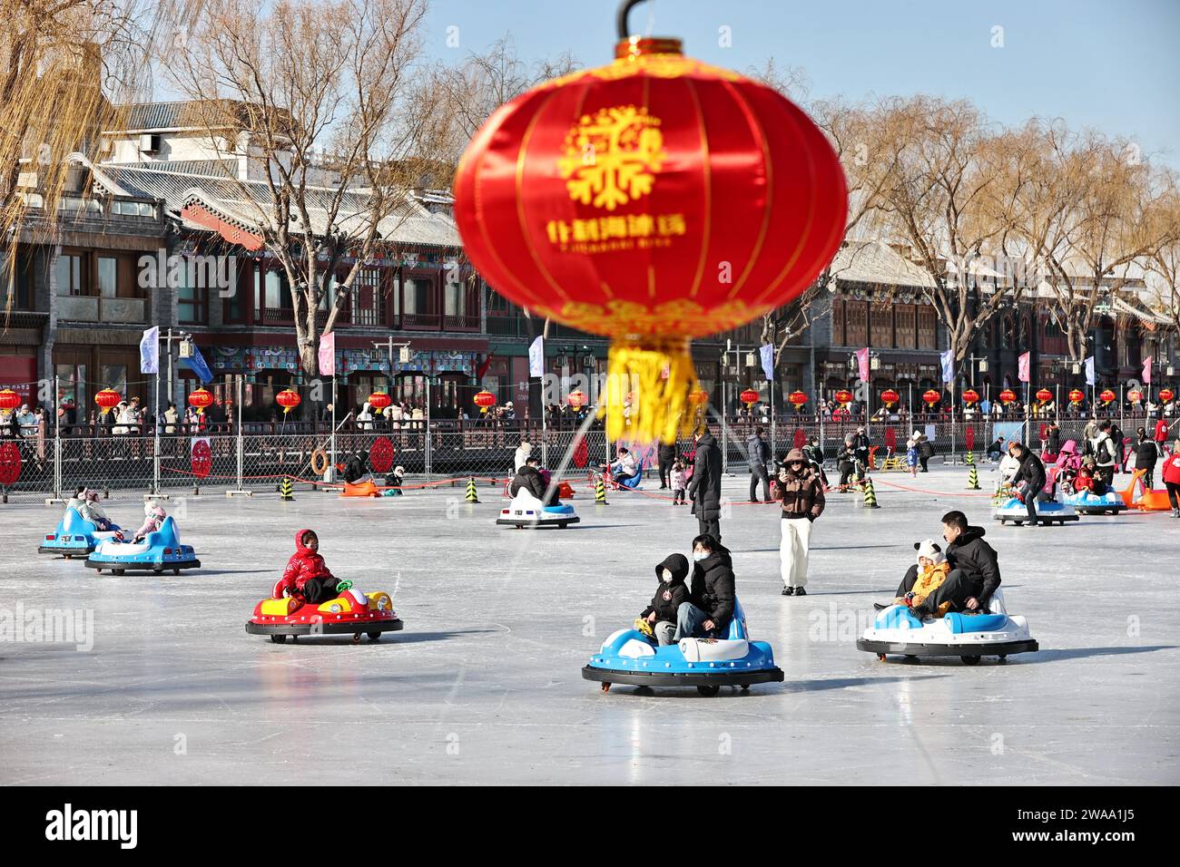 Tourists enjoy ice and snow fun at Shichahai ice rink in Beijing, China ...