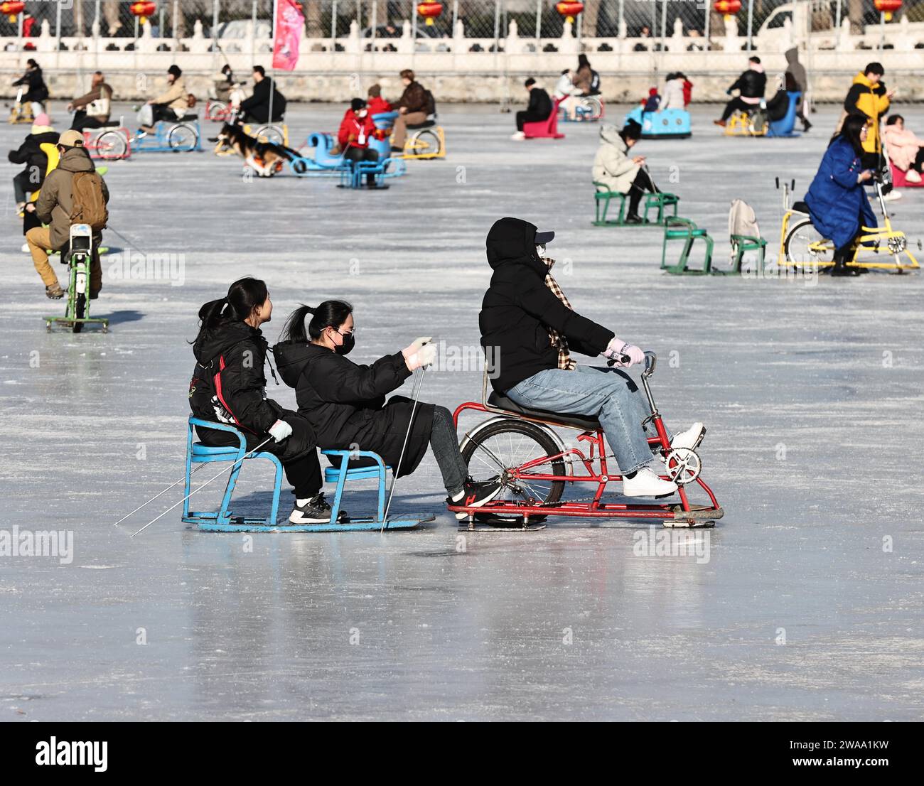 Tourists enjoy ice and snow fun at Shichahai ice rink in Beijing, China ...