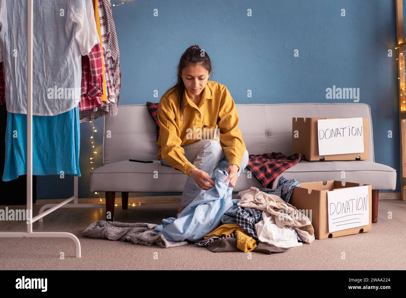 Woman collects clothes in hi-res stock photography and images - Alamy