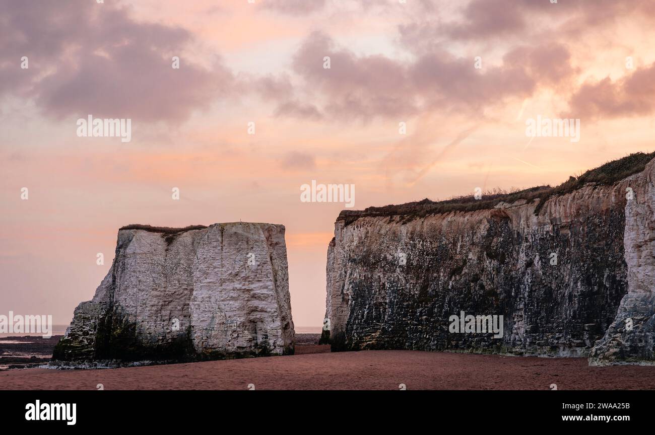 The distinctive sea stacks and archway in the chalk cliffs between ...