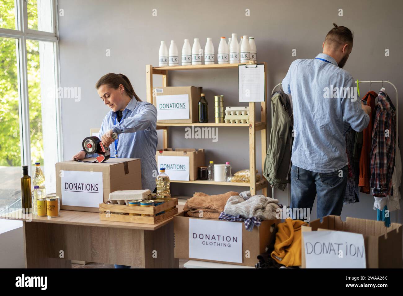 Volunteers with food boxes working at distribution or refugee ...
