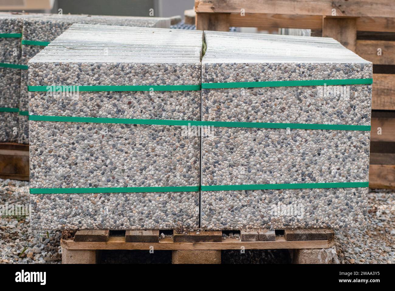 Concrete floor tiles with pebblestone texture. Tiles in a lot bound ...