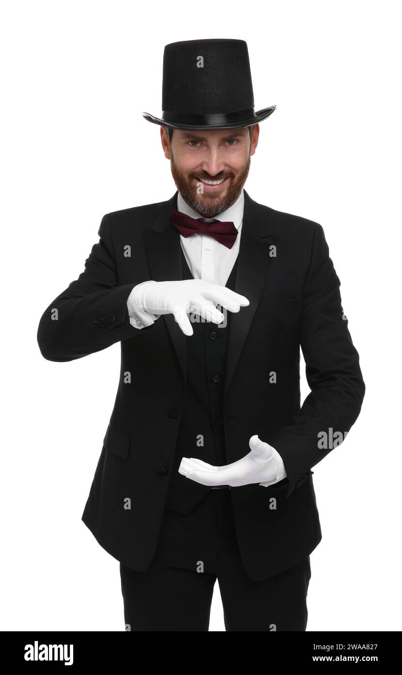 Happy magician in top hat holding something on white background Stock ...