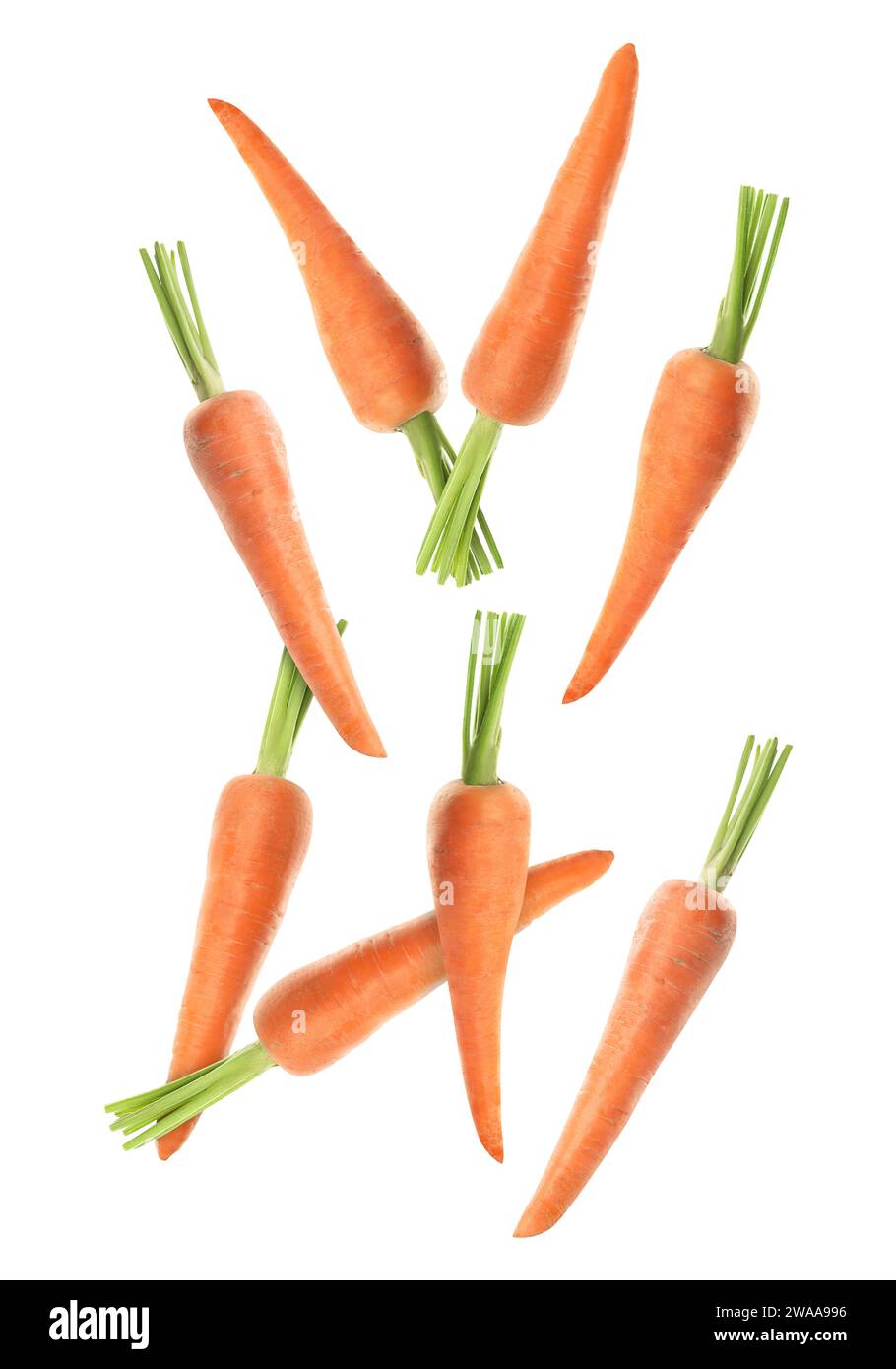 Fresh ripe carrots falling on white background Stock Photo - Alamy