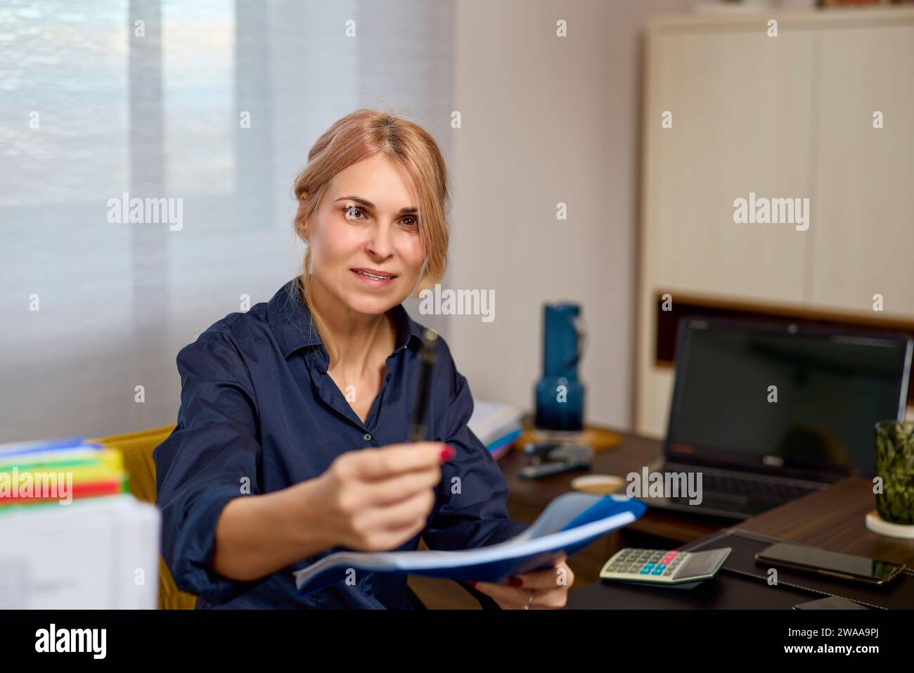 Back to work, Middle aged business woman working at office, different ...