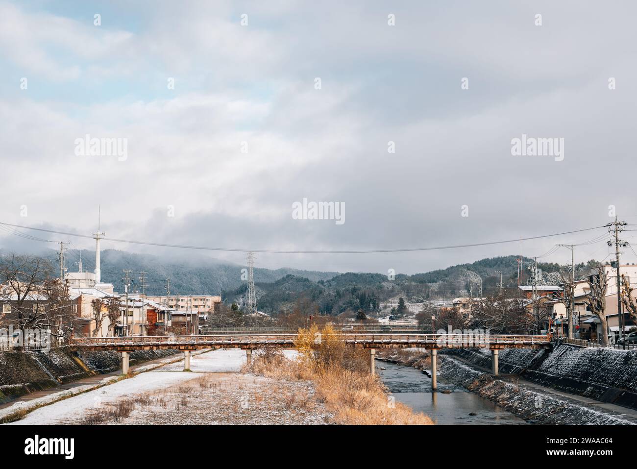 View of Takayama village and miyagawa river with winter snow in Gifu ...