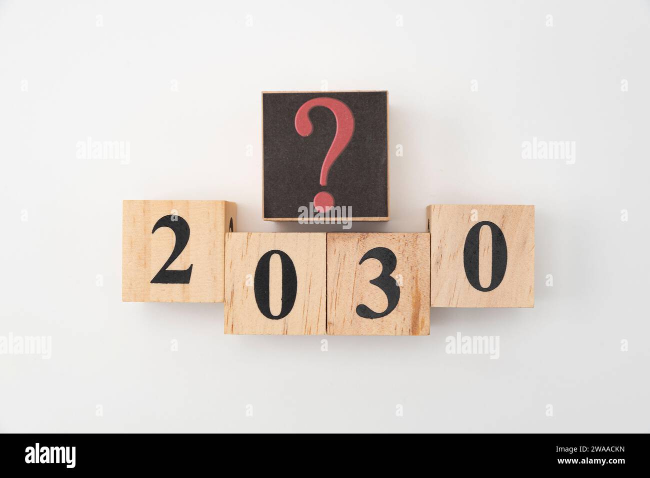 Number 2030 and question mark written on wooden blocks isolated on ...
