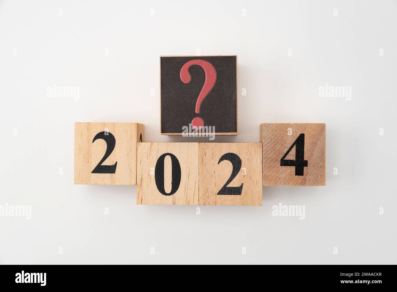 Number 2024 and question mark written on wooden blocks isolated on ...