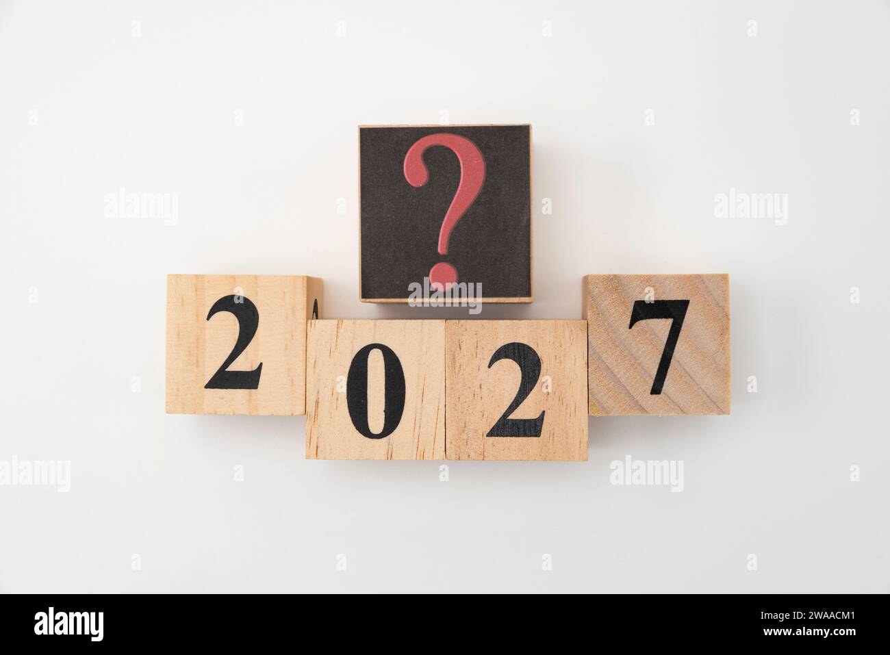 Number 2027 and question mark written on wooden blocks isolated on ...