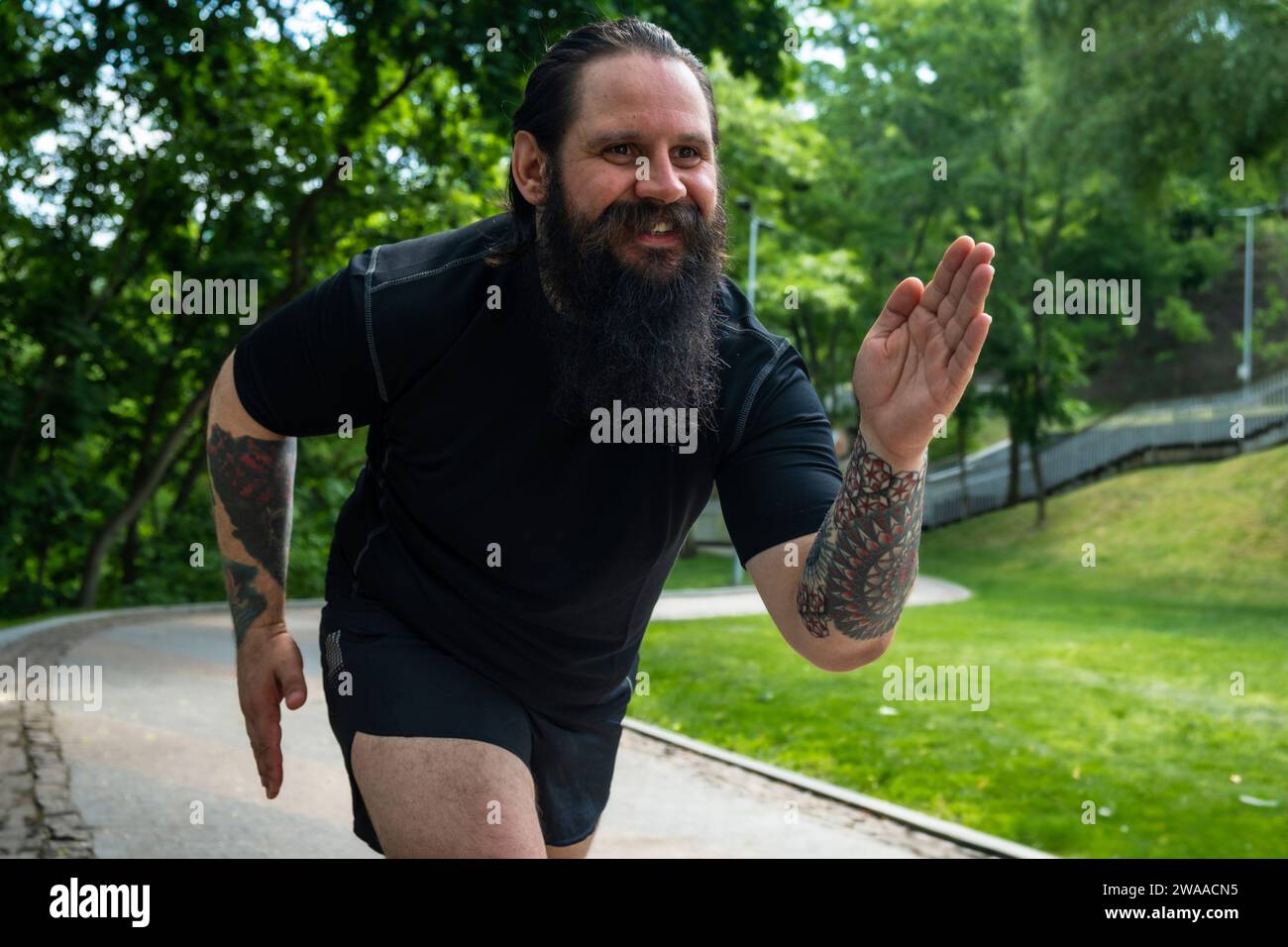 smiling man running in nature Stock Photo - Alamy