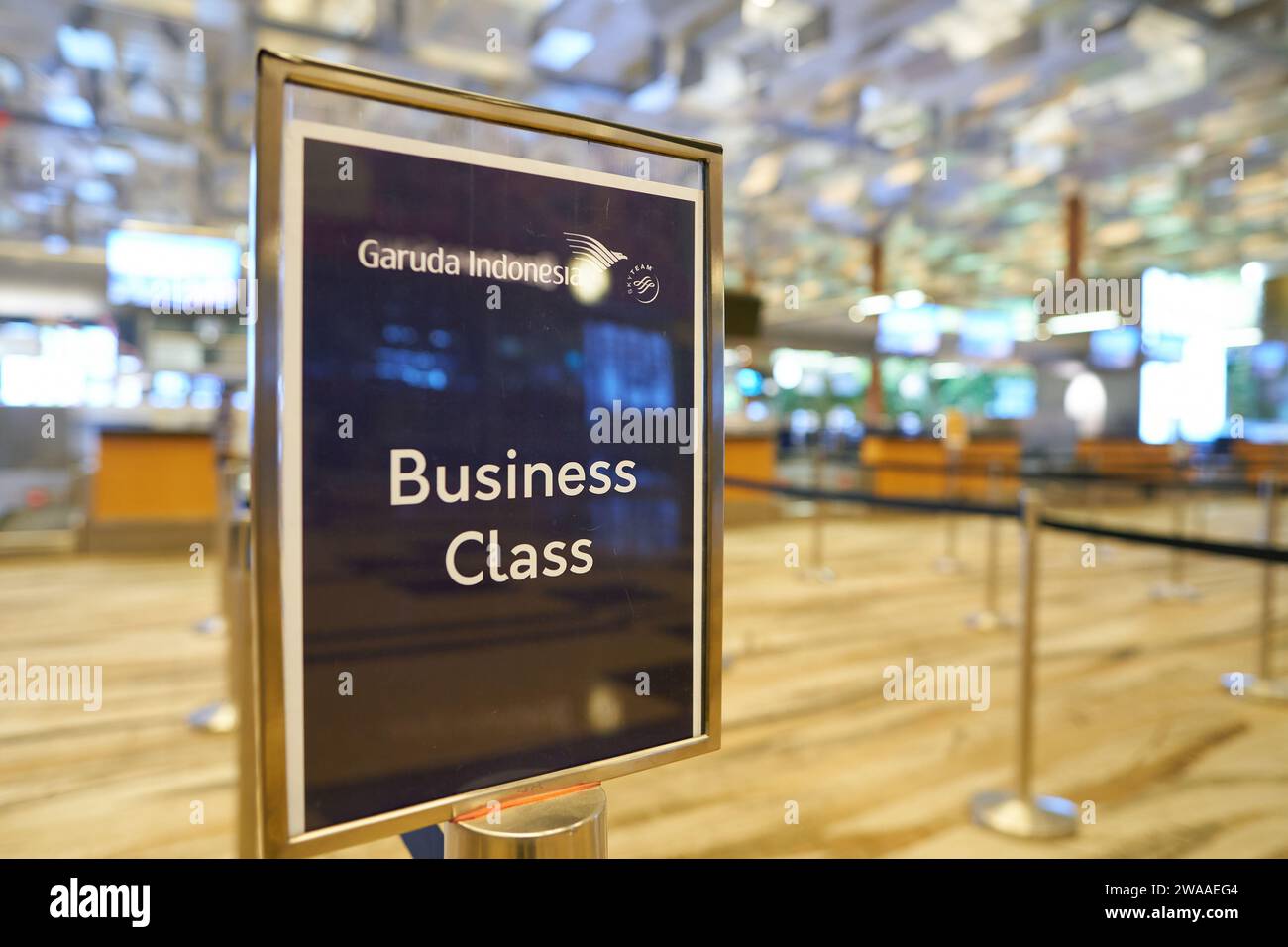 SINGAPORE - NOVEMBER 07, 2023: Garuda Indonesia business class check in ...