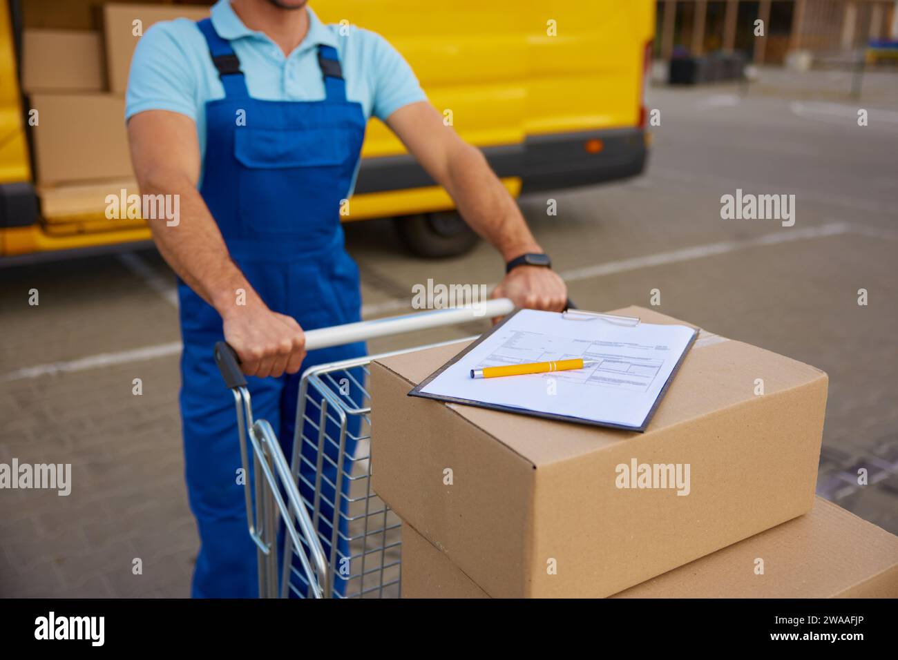 Closeup trolley cart with cardboard box stack and clipboard checklist ...