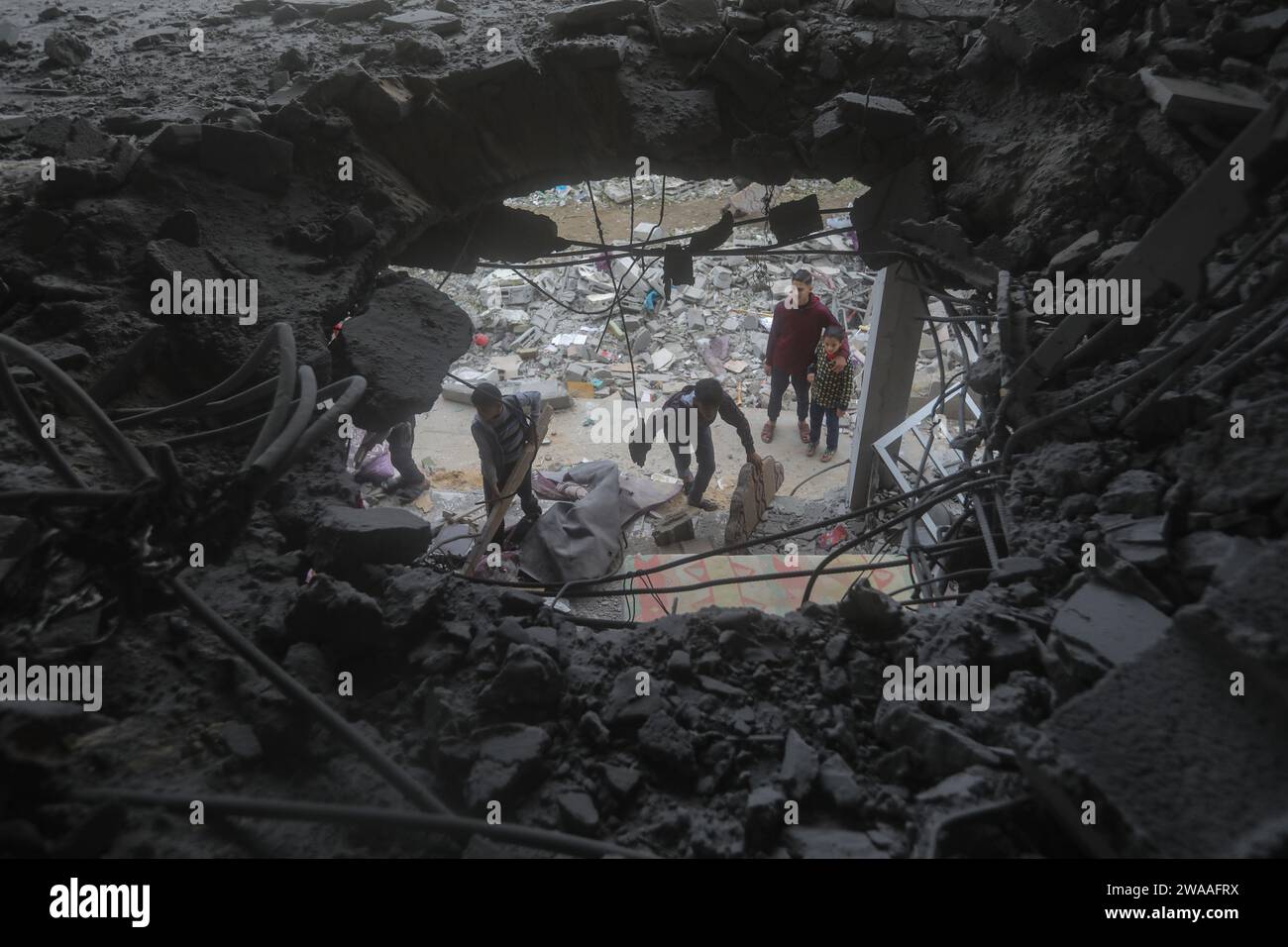 Rafah, Palestinian Territories. 03rd Jan, 2024. People inspect the ...