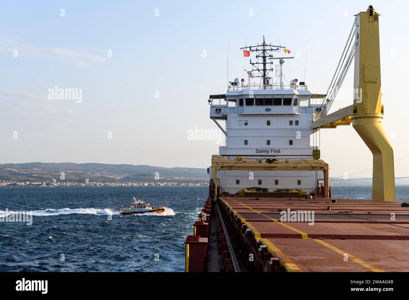 Pilot boat and cargo vessel at sea. Pilot embarkation. Pilotage Stock ...