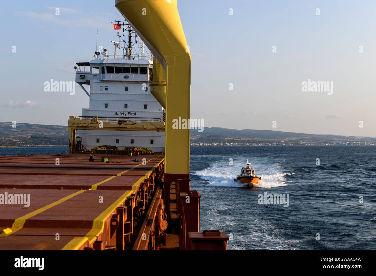 Pilot boat and cargo vessel at sea. Pilot embarkation. Pilotage Stock ...