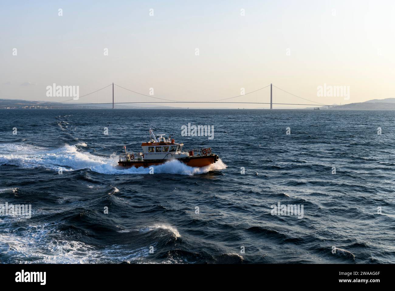 Pilot boat and cargo vessel at sea. Pilot embarkation. Pilotage Stock ...