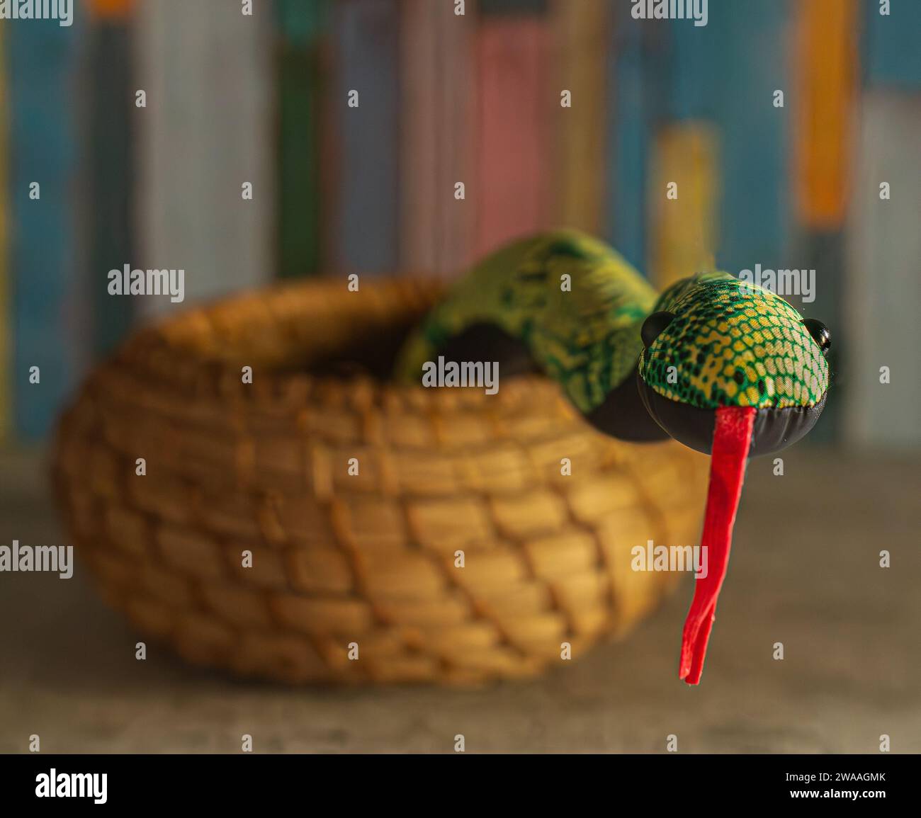 Cute Stuffed Toy Snake Charmer Rising from Basket Stock Photo - Alamy