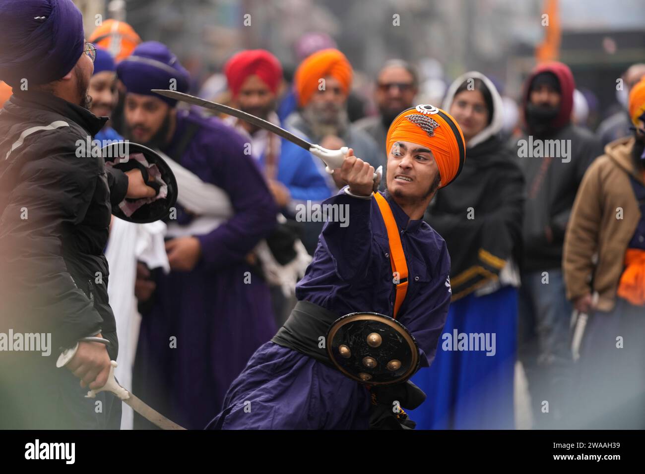 An Indian Sikh warrior displays martial arts skills in a religious ...