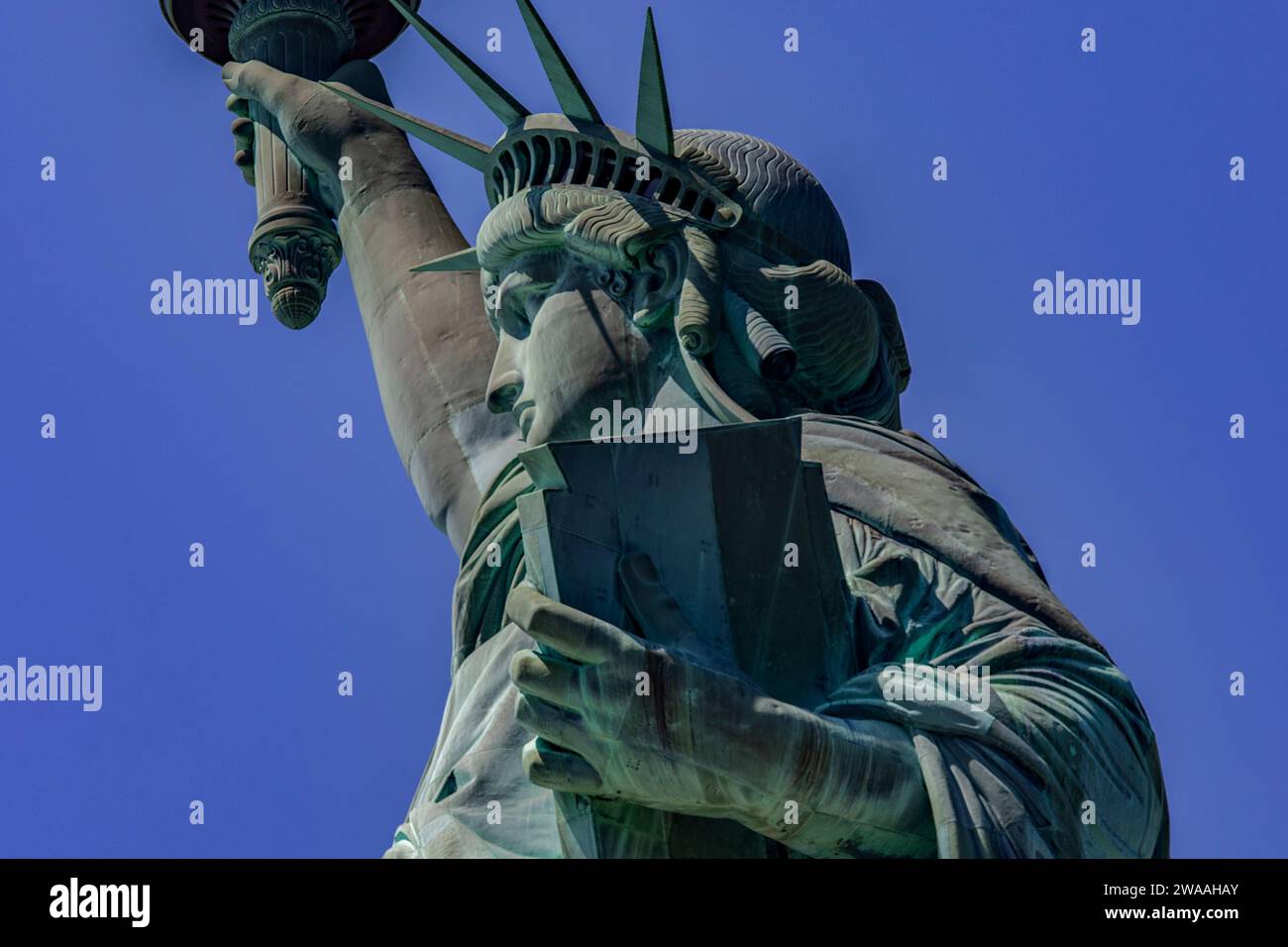 The Statue of Liberty with her crown holding her torch under a stunning ...
