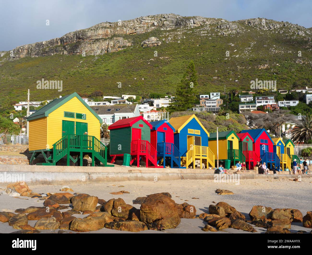 Beach Huts at False Bay, Muizenberg, Cape Town. Brightly coloured beach ...