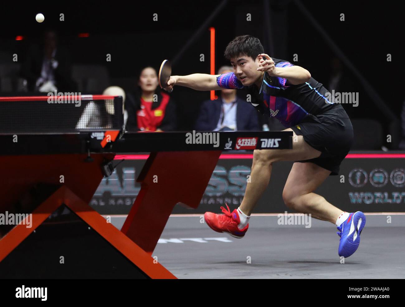 Doha, Qatar. 3rd Jan, 2024. Liang Jingkun hits a return during the men ...