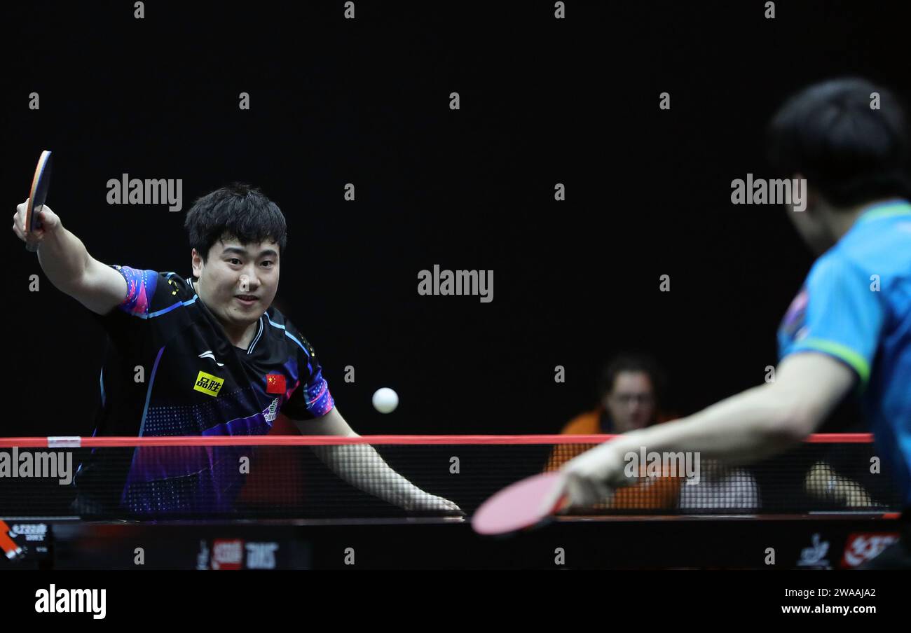 Doha, Qatar. 3rd Jan, 2024. Liang Jingkun hits a return during the men ...