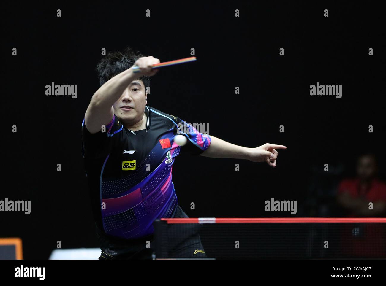 Doha, Qatar. 3rd Jan, 2024. Liang Jingkun hits a return during the men ...