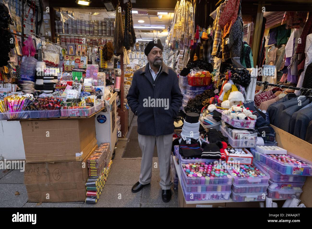 A shopkeeper on the high street at Southall, West London, the largest ...