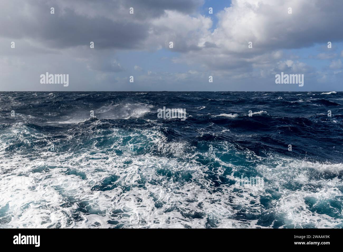 Beautiful seascape - waves and sky with clouds with beautiful lighting ...