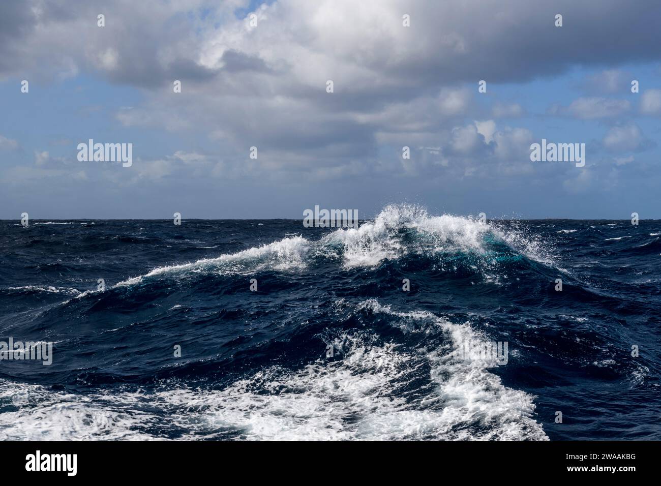 Beautiful seascape - waves and sky with clouds with beautiful lighting ...
