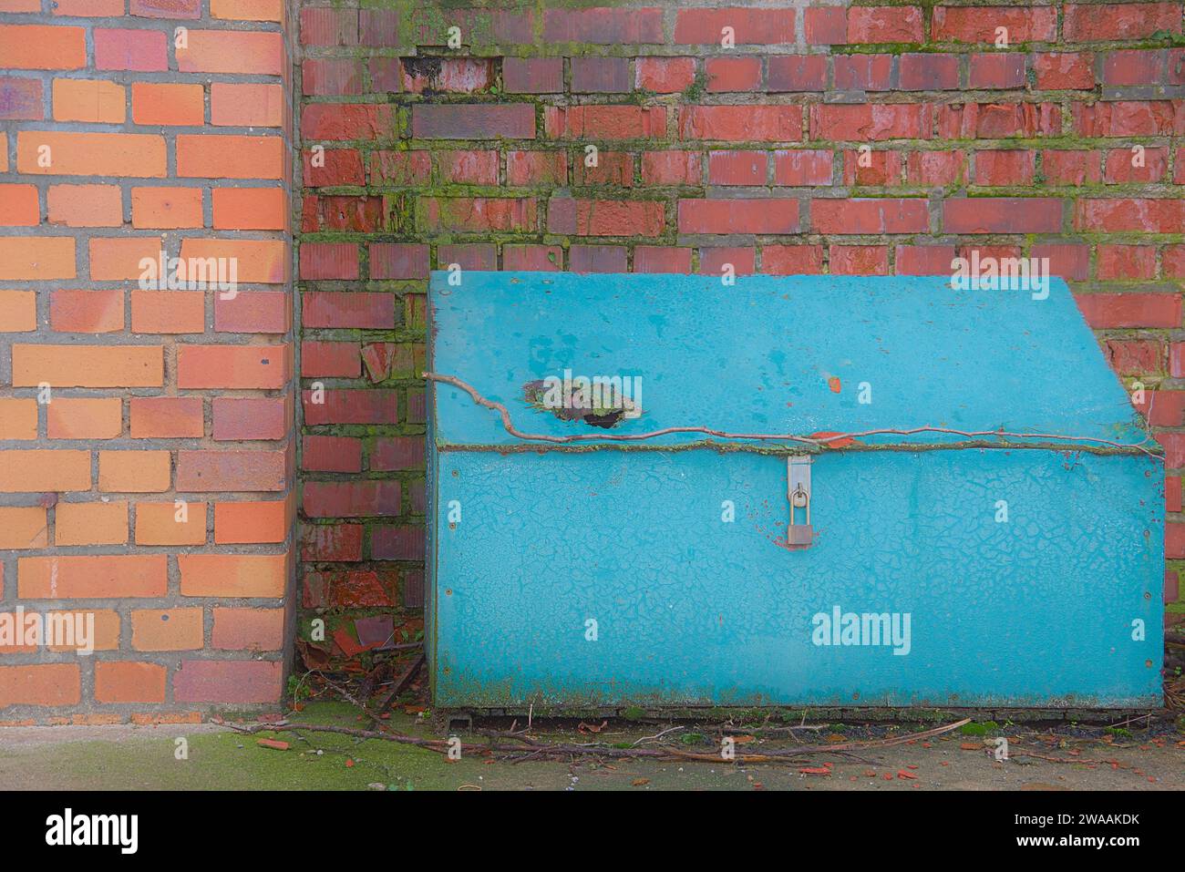 turquoise box and red a brick wall. High color contrast Stock Photo - Alamy